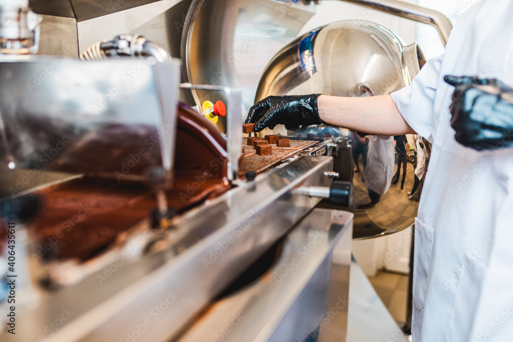 Professional confectioner making delicious chocolate sweets. Sweets ...