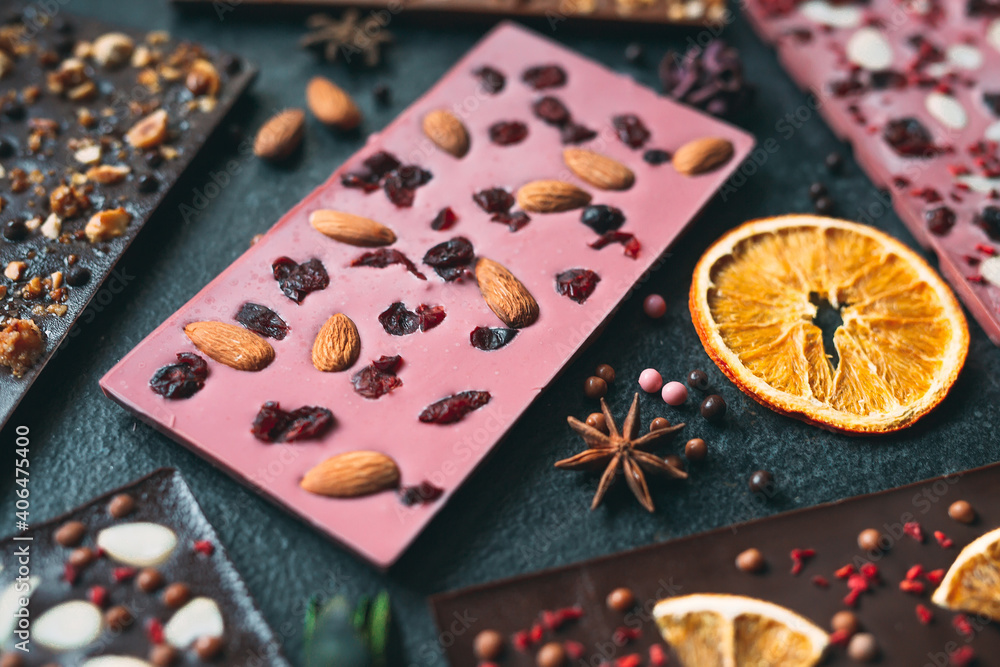 Handmade chocolate bars with a variety of dried fruit and nut toppings ...
