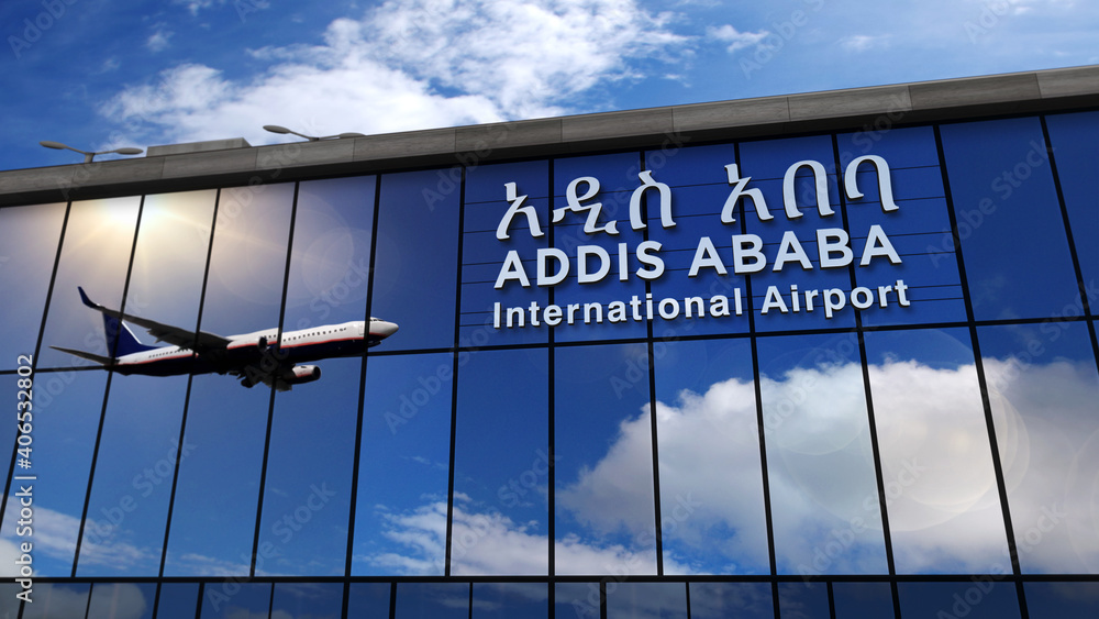 Airplane landing at Addis Ababa Ethiopia airport mirrored in terminal ...