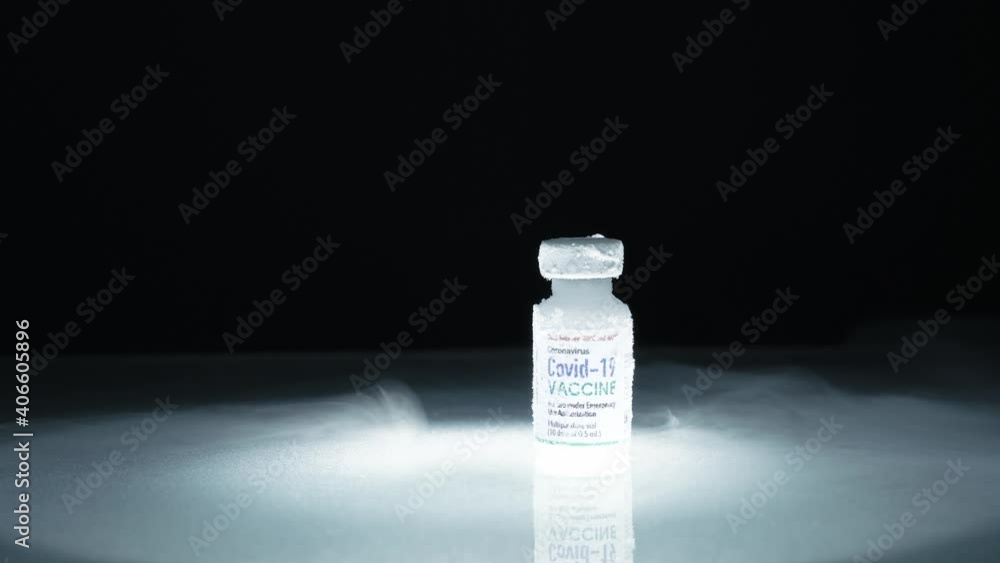 Researcher's hand pick up frozen cold Vaccine vial for Covid-19 with ...