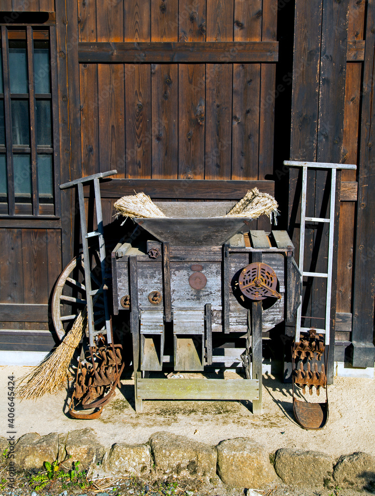 Old machinery and handcrafted wooden objects in the traditional village ...
