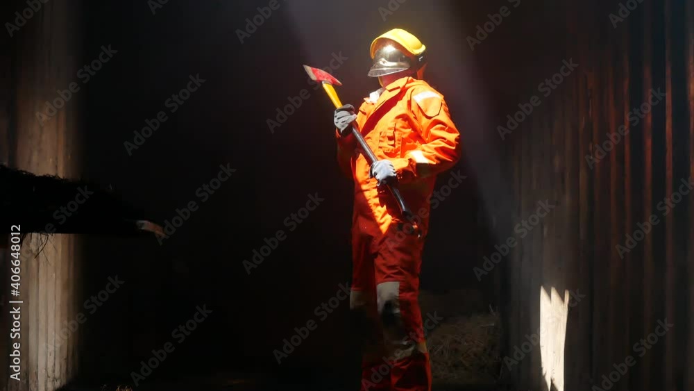 Firefighter fighting with fire flame protection property. Fireman wear ...