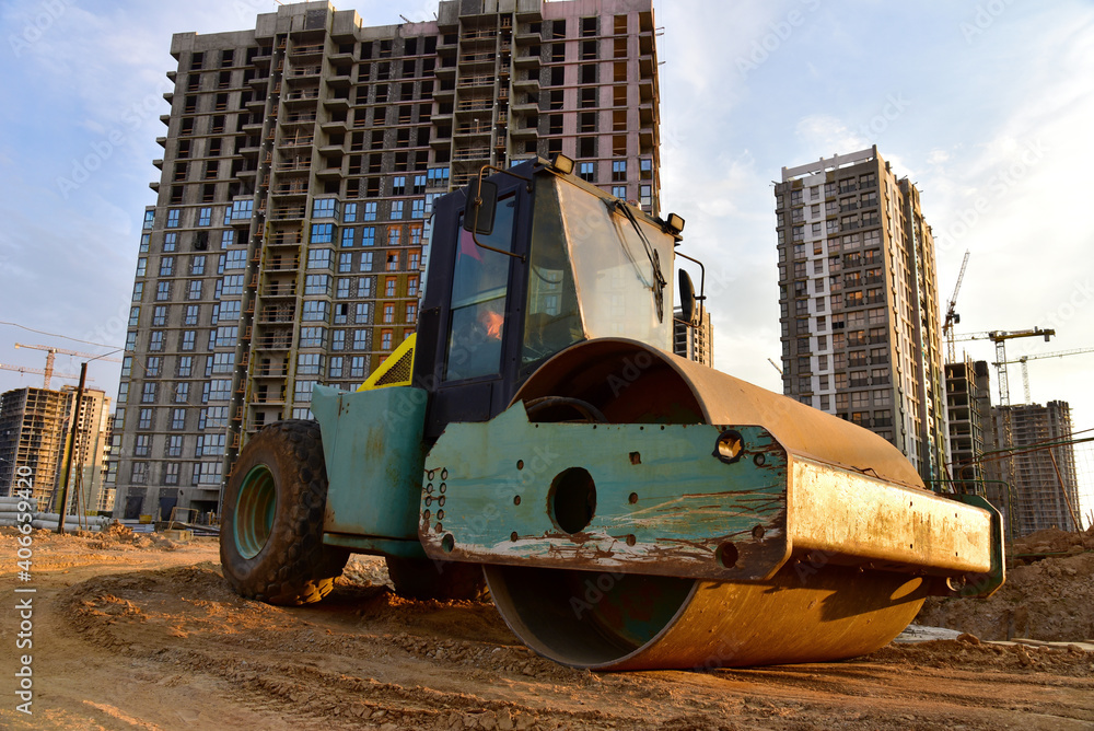 Vibro Roller Soil Compactor leveling ground at construction site ...