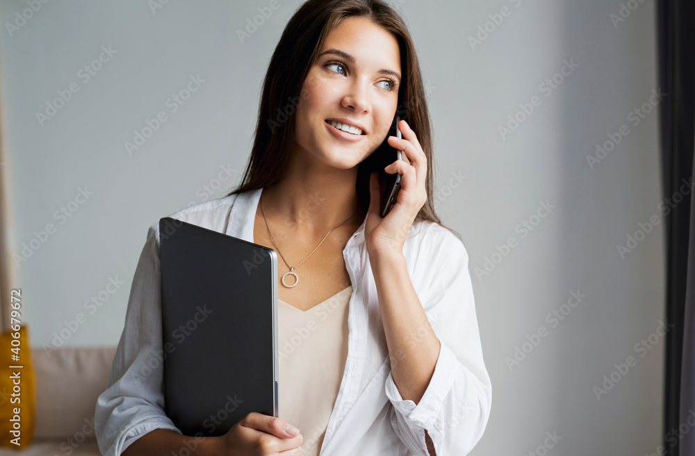 Portrait of business woman, holds smartphone in her hands. Beautiful ...