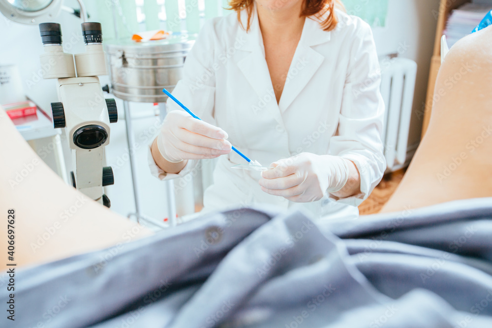 Unrecognizable female doctor gynecologist working with patient. Vaginal ...