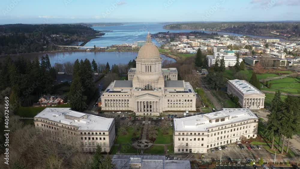 Cinematic drone rise and reverse shot of the Washington state capitol ...