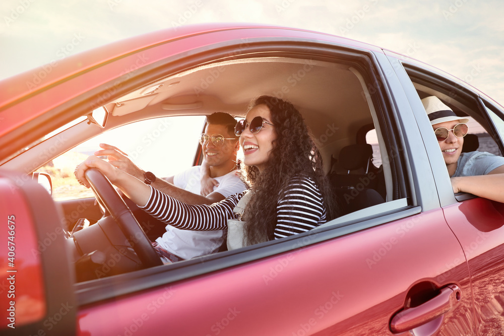 Foto de Happy friends together in car on road trip do Stock | Adobe Stock