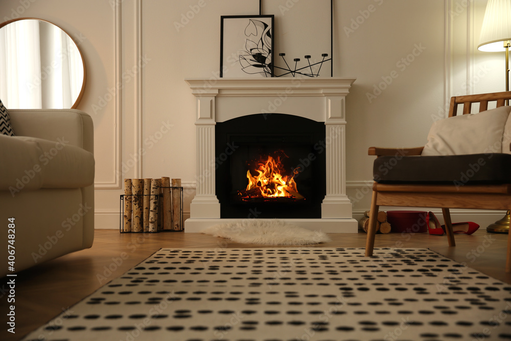 Modern fireplace with burning wood in room. Interior design Stock Photo ...