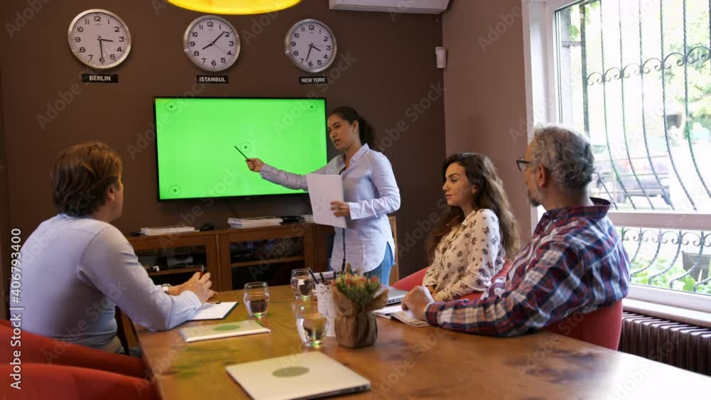 Happy and confident smiling business workers group looking at graphics ...
