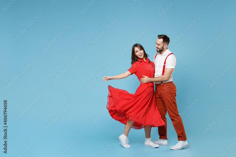 Full length of funny young couple two friends man woman in white red ...