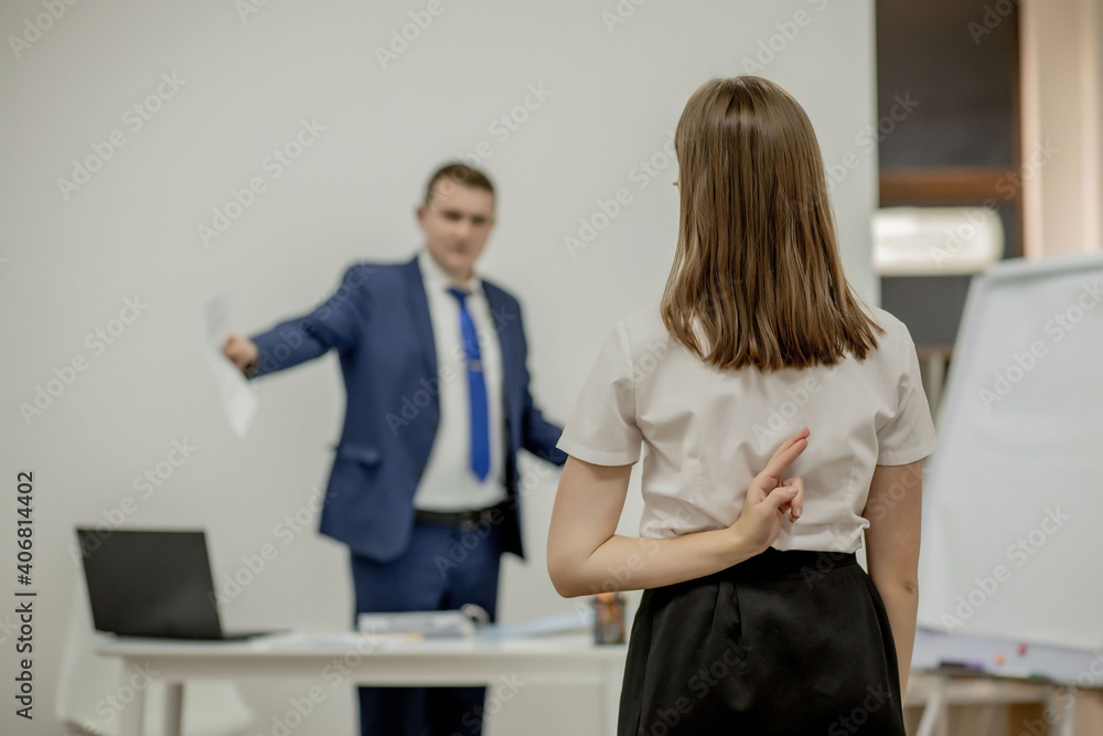 Angry boss yelling at his young employee, she is stressed and feeling ...