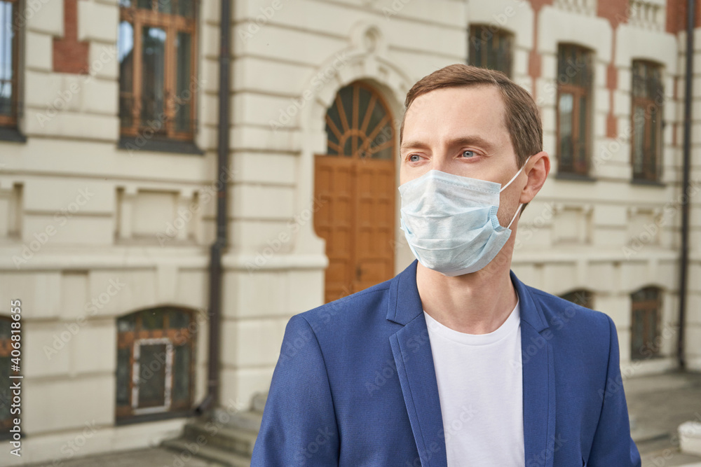 Man in protective face mask at city. Male person portrait. Lockdown ...