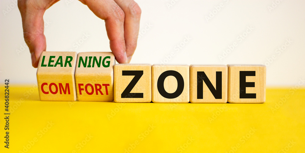 Comfort or learning zone symbol. Hand turns wooden cubes and changes ...