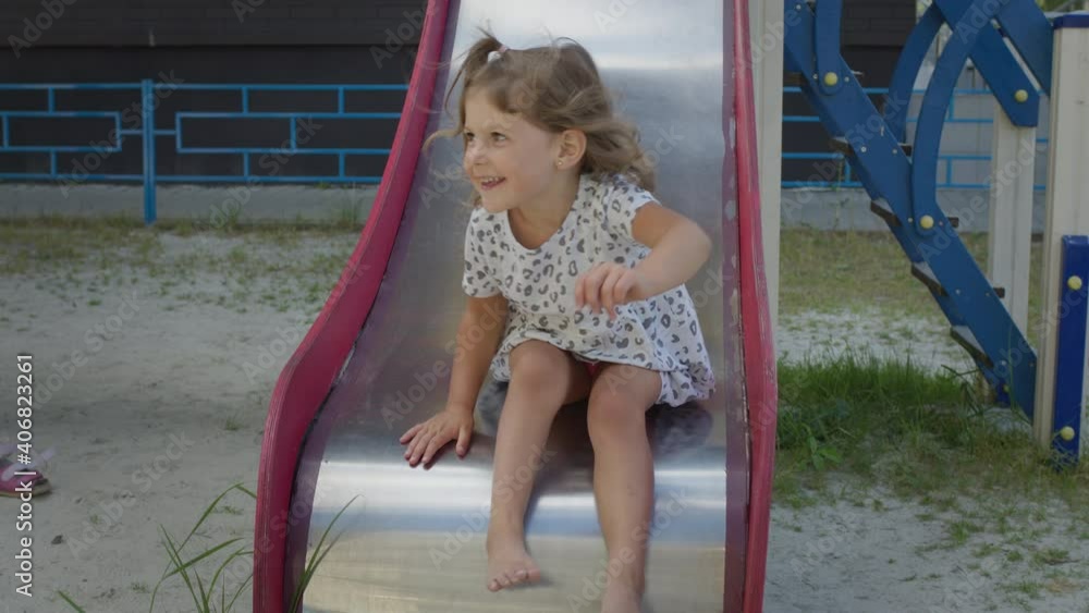Little Girl On The Playground. Girl Runs Out On The Slide And Gets Off ...