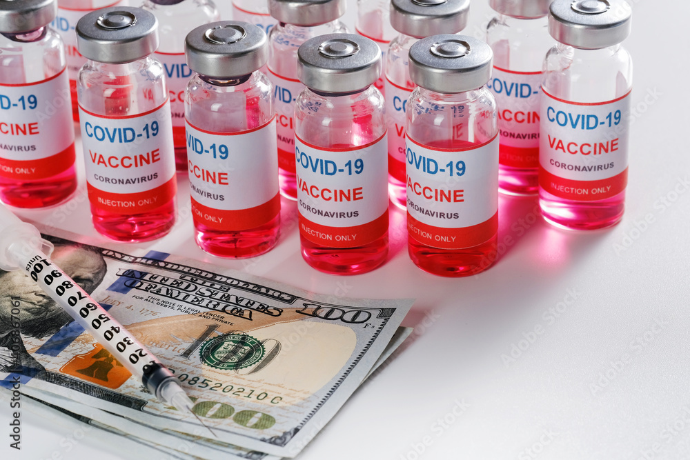 Vaccine vials, syringe and money for purchase or trading vaccine ...