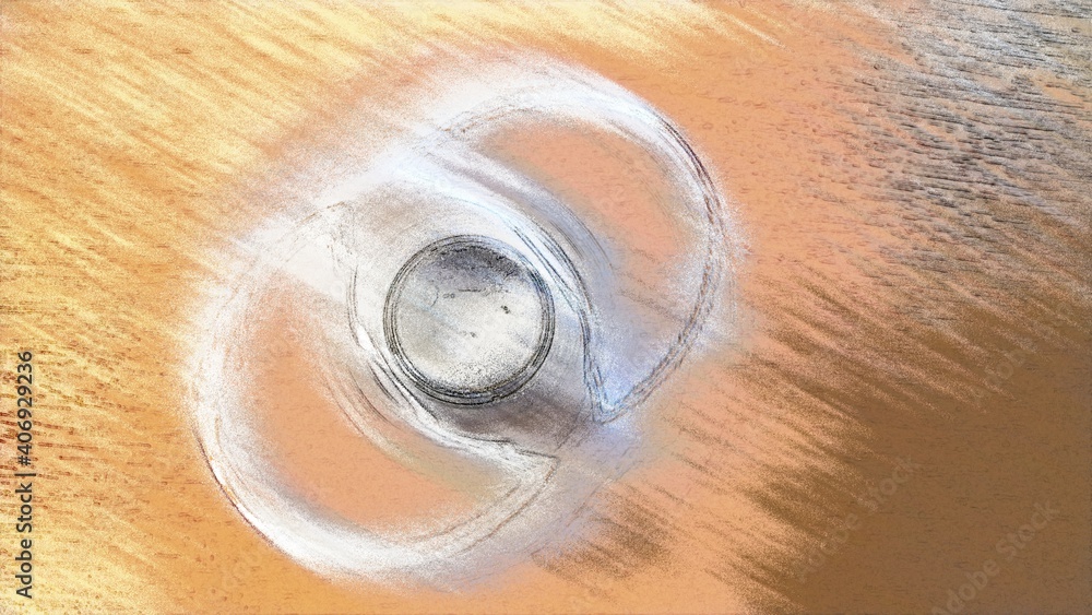 Metal spinner on brown table A metal spinner lies and rotates at high ...