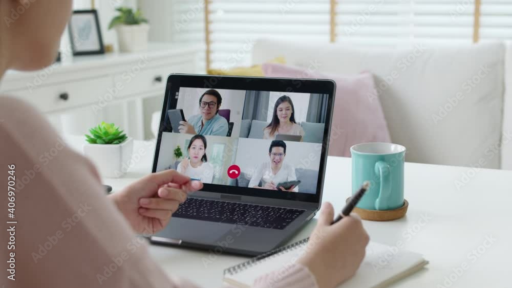 Back view of business woman talking about sale report in video ...