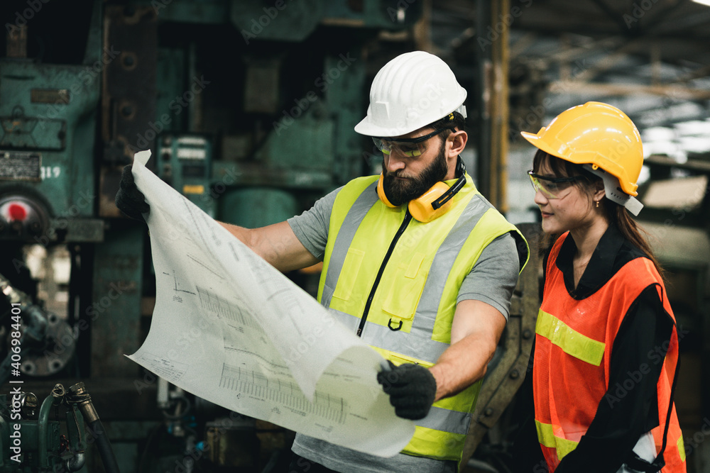 Two maintenance engineers men and women inspect relay protection system ...