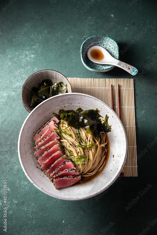 Japanese ramen. Asian soup with noodles ramen, miso, fried tuna steak and seaweed algae Stock ...