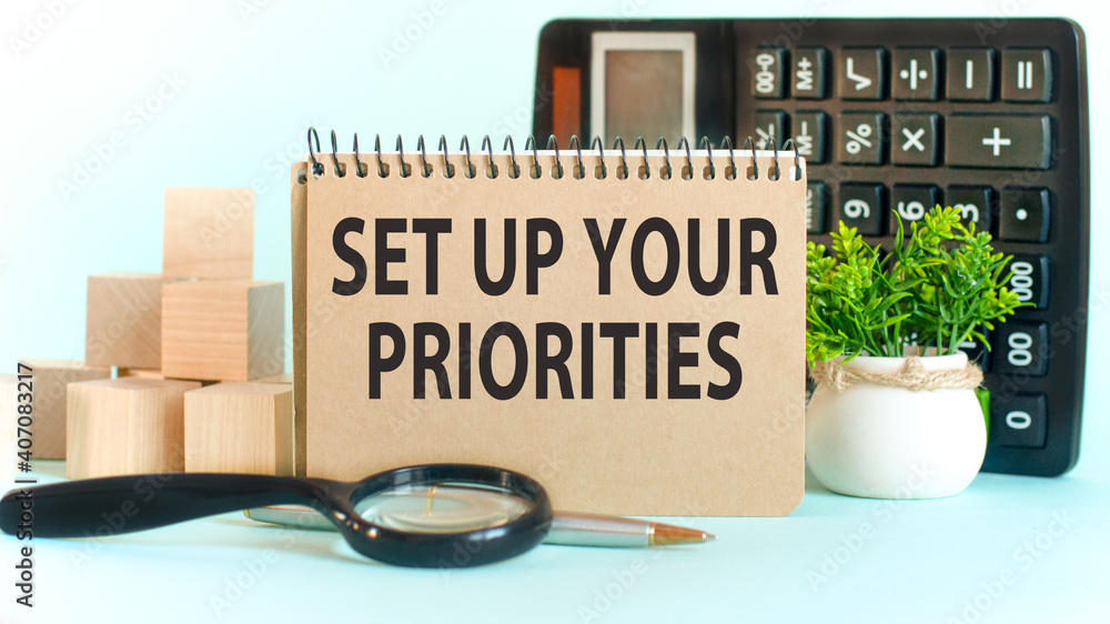 Business concept. Notebook with text Set up your priorities sheet of ...