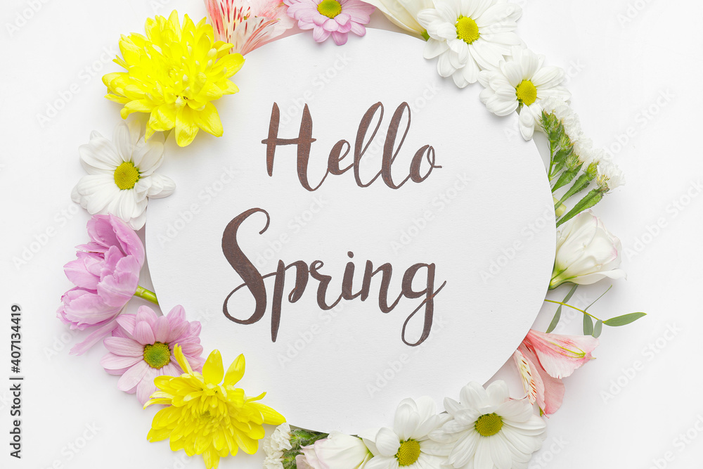Card with text HELLO SPRING and beautiful flowers on white background ...