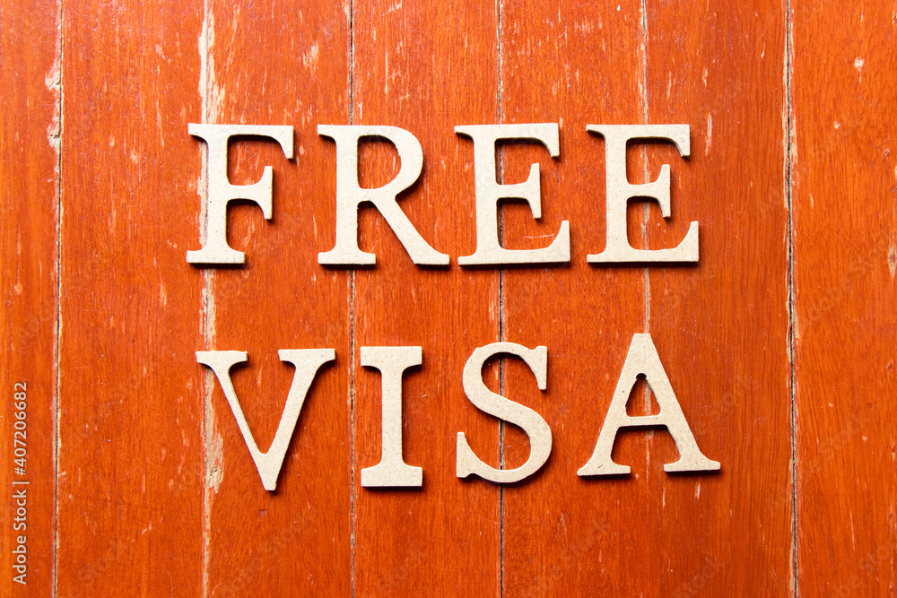 Alphabet letter in word free visa on old red color wood plate ...