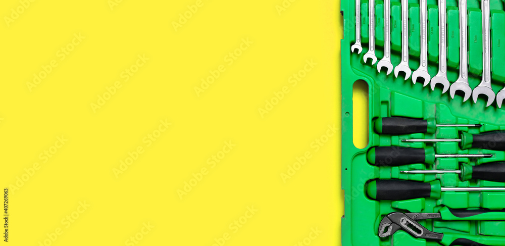 Green construction tool set: wrenches, adjustable pliers, screwdriver ...