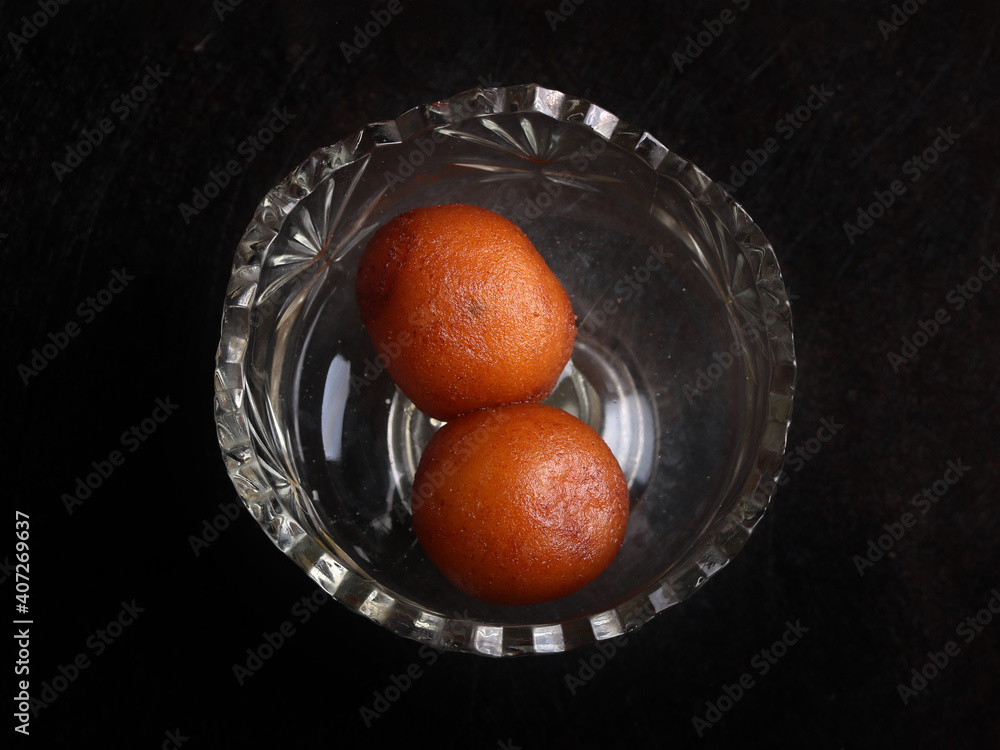 Two gulab Jamun in Glass Bowl on Black Background Indian, Pakistani ...