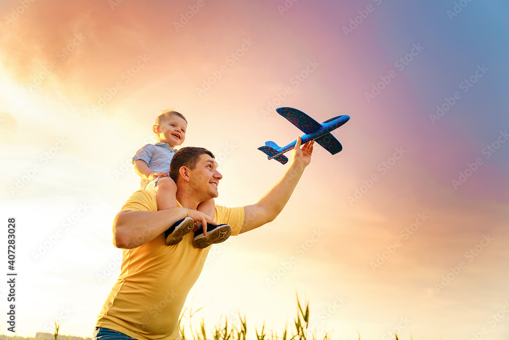 happy father with son playing with toy plane. dream to be a pilot ...