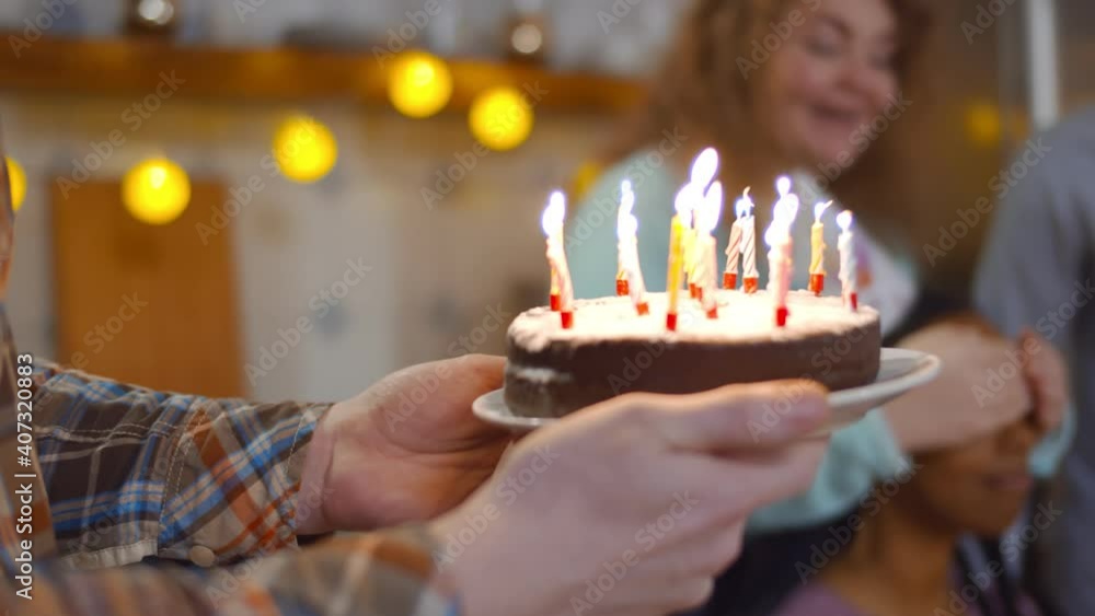 Group of friends wishing happy birthday to young african woman and ...