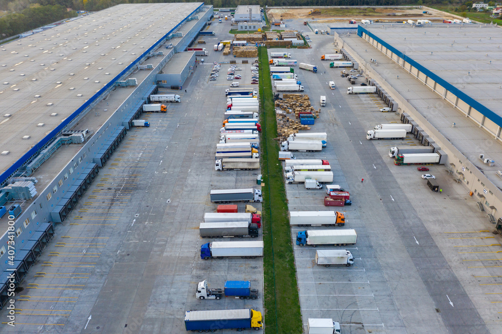 Logistics park with a loading hub. A lot of semi-trailer trucks stand ...