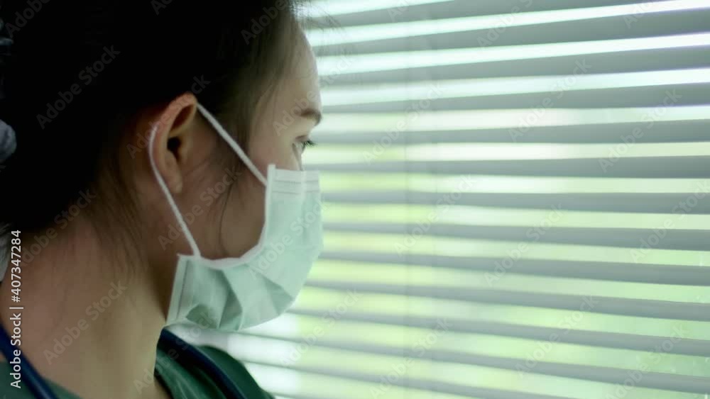 Sad depressed anxious close up face Asian female doctor surgeon ...