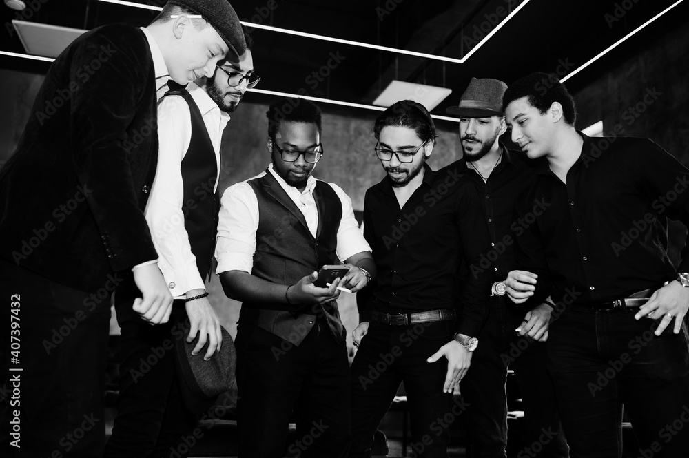 Group of handsome retro well-dressed man gangsters spend time at club ...