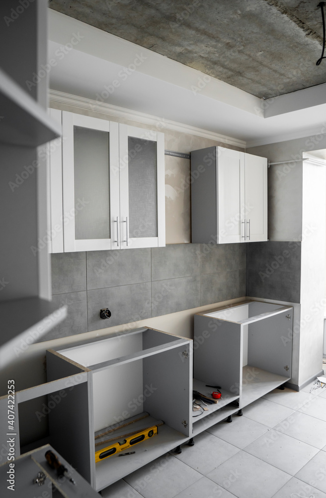 Custom kitchen cabinets installation with a white furniture facades mdf ...