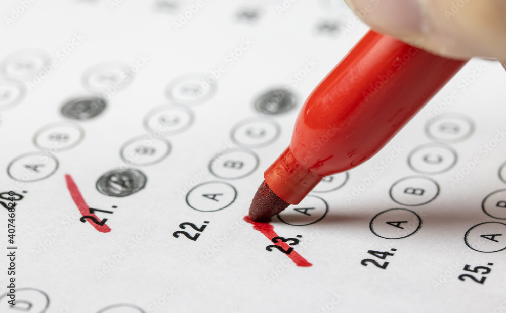 red mark on multiple choice test answer sheet Stock Photo | Adobe Stock
