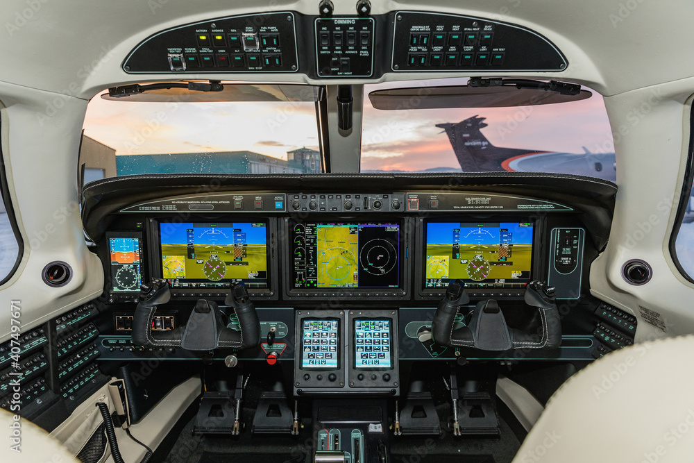View into the cockpit of a sports plane. Modern Glass cockpit of a ...