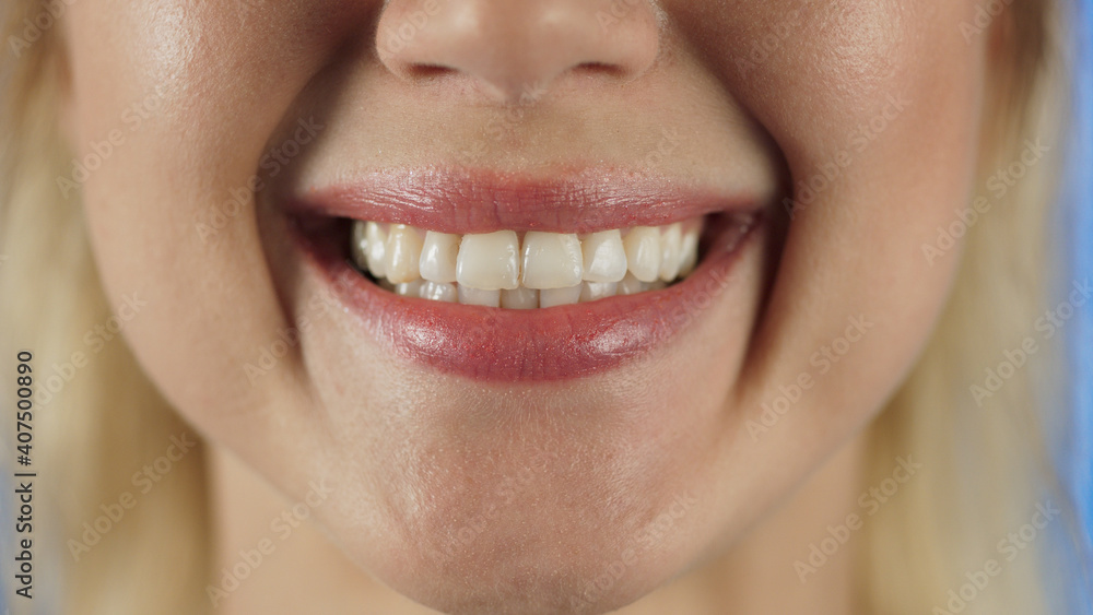Young woman with beautiful lips smiling at the camera and making ...