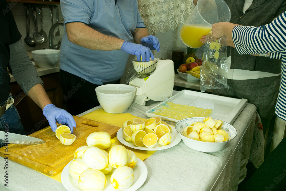 The process of making limoncello lemon liqueur at home. Four people ...