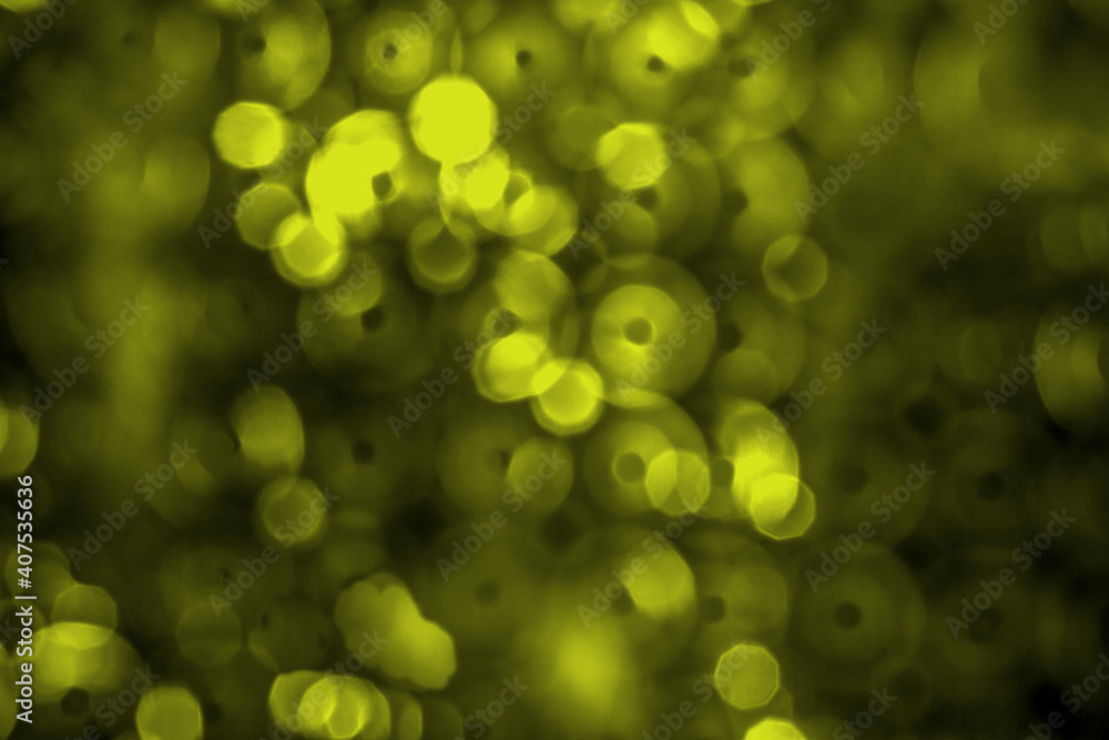 Abstract yellow backlight reflector and glitter bokeh lights background ...