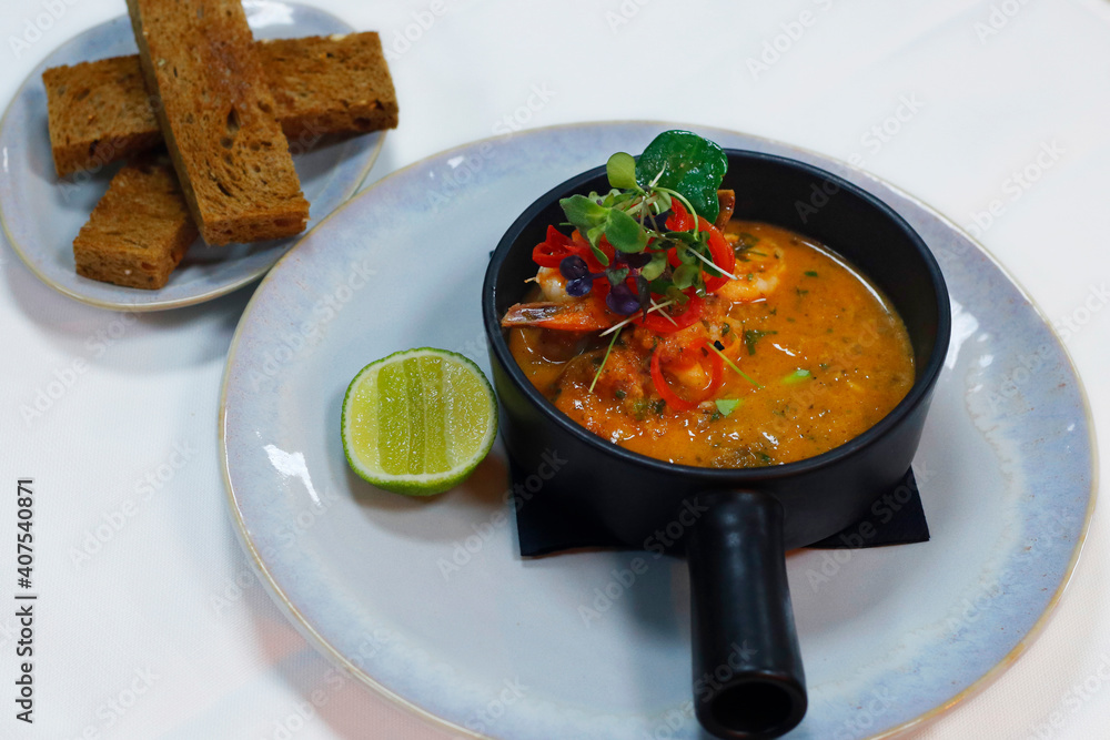 sauted king prawns in spicy tomato sauce with toasted bread Stock Photo ...