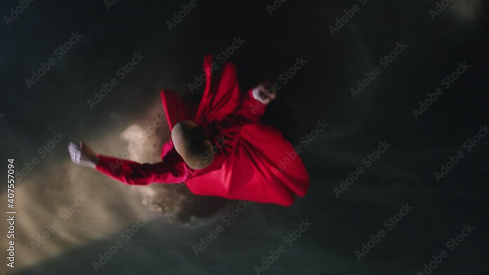 Whirling dervish with red clothes in a black background. Mevlevi ...