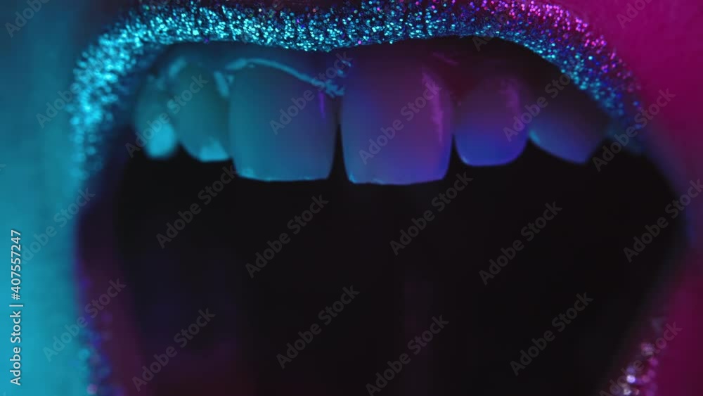 Anger mouth gesture of fashion model with sparkles on lips. Sinister ...