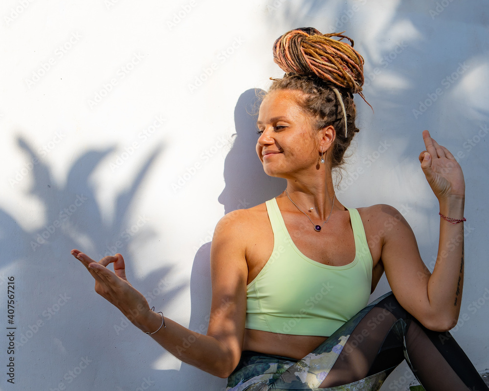 Young woman practicing Purna Matsyendrasana, Full Spinal Twist pose ...