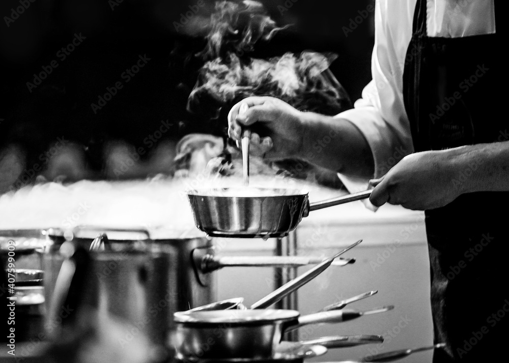 Chef cooking in a kitchen, chef at work, Black and White. Stock Photo ...