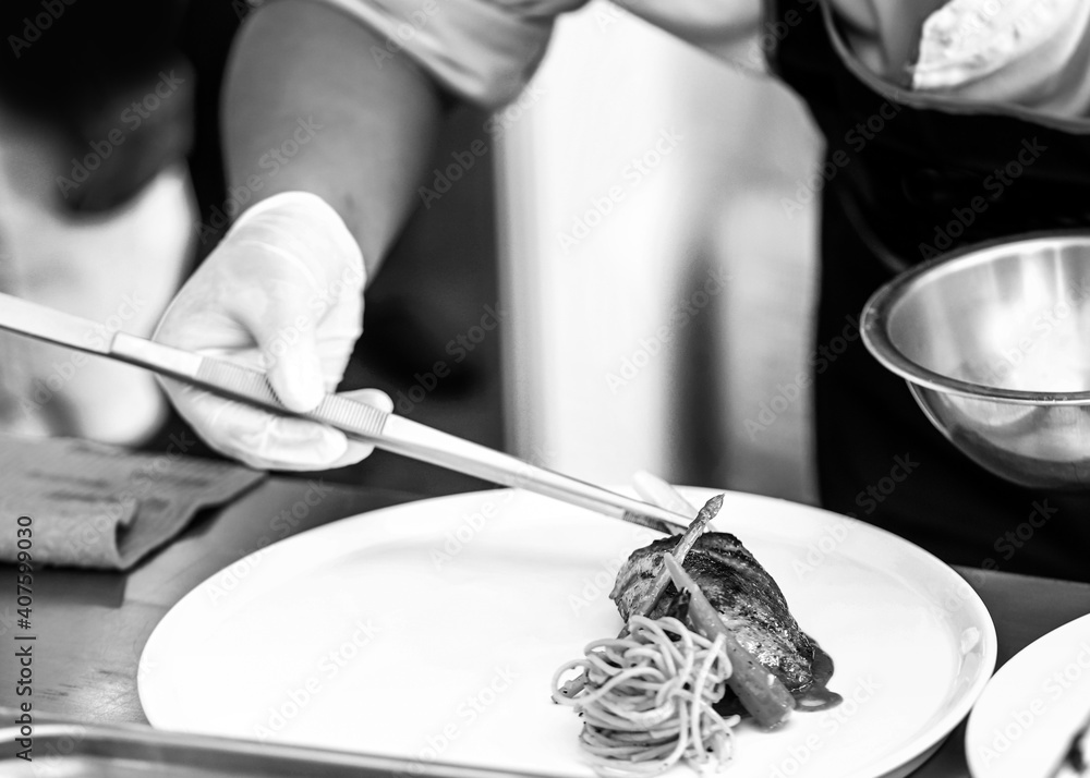 Chef cooking in a kitchen, chef at work, Black and White. Stock Photo ...