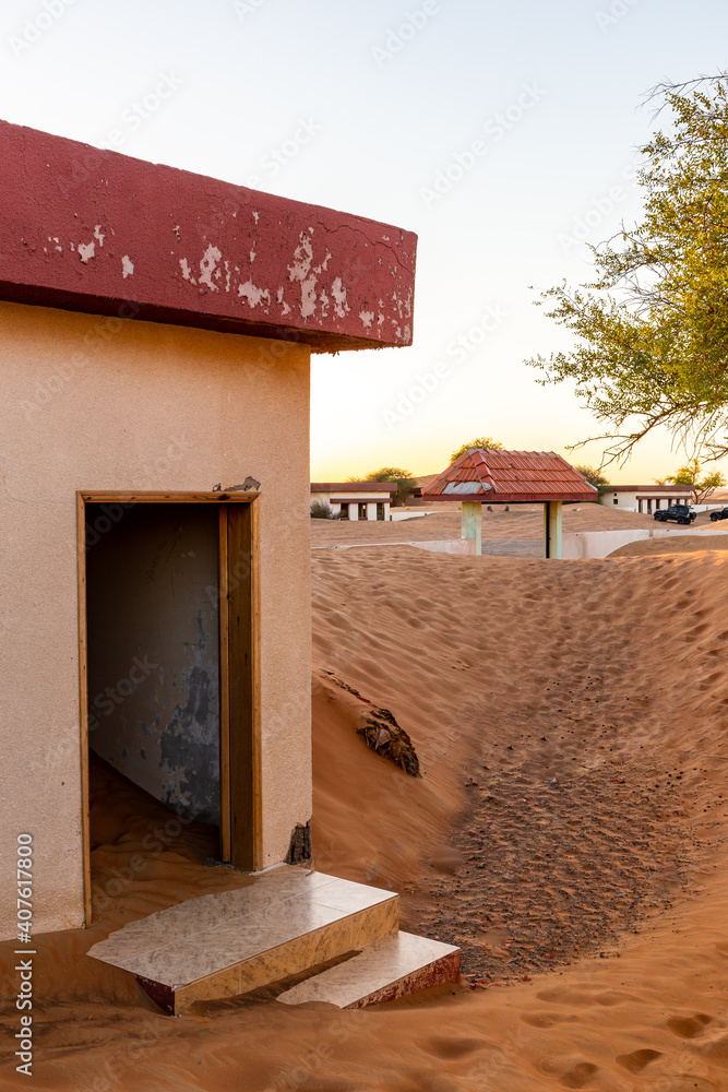 Abandoned residential buildings buried in sand in Al Madam ghost ...