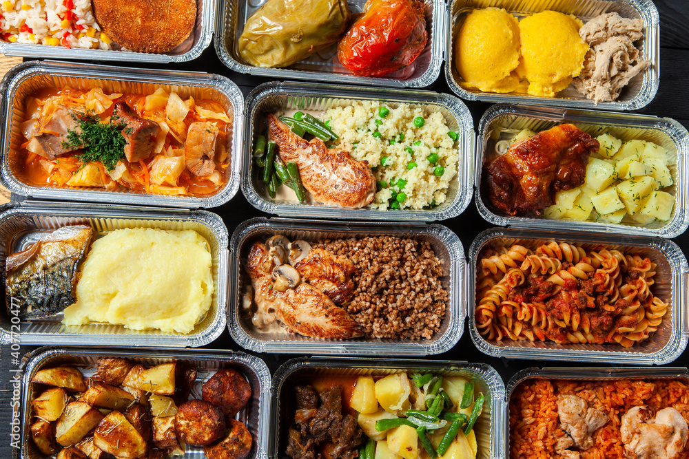 Business lunch in eco plastic container ready for delivery.Top view ...