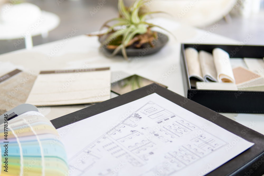 Interior designer's working table, an architectural plan of the house ...