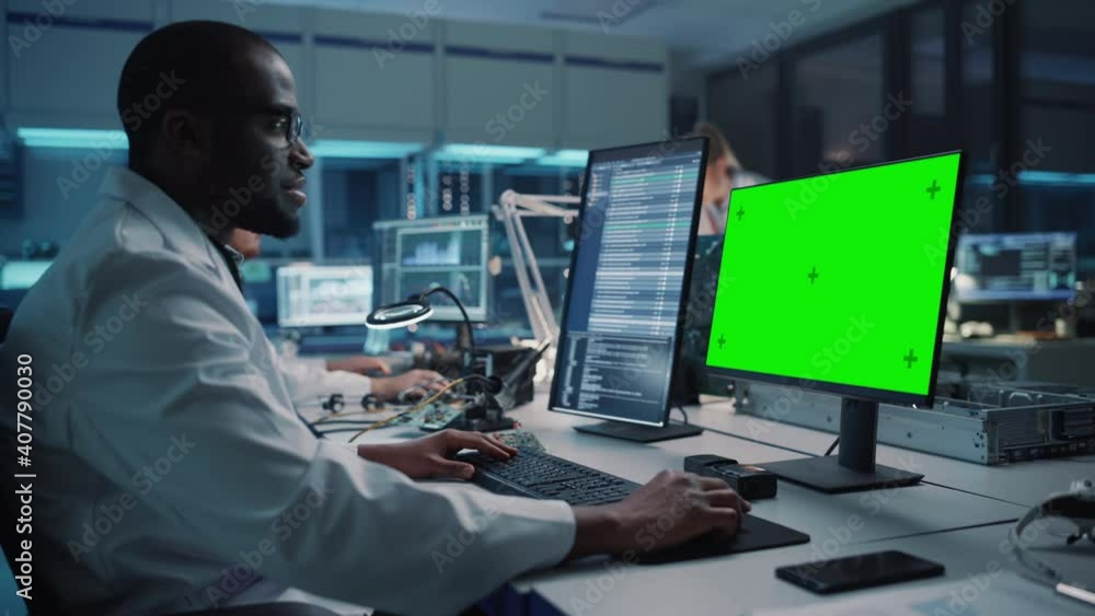 Modern Electronics Facility: Scientist, Engineer Works on Green Chroma ...