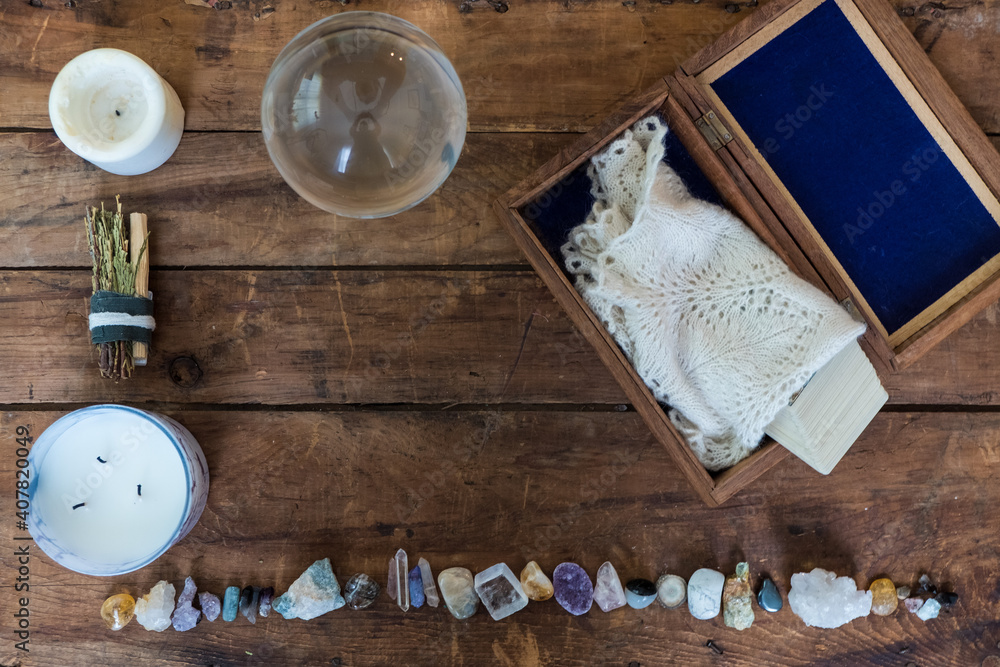 Metaphysical background with crystal ball, tarot cards, candles ...